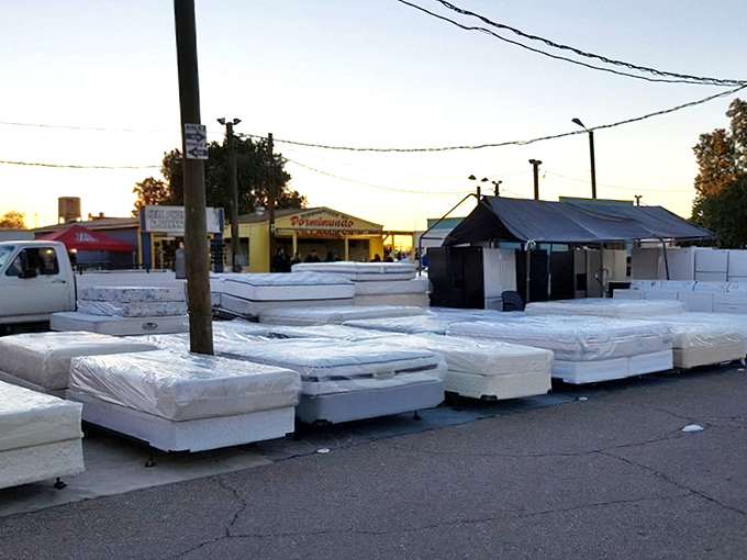 The mattress district – where dreams are sold by the dozen and delivery trucks stand ready for your impulse purchase.