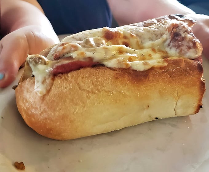 Melted cheese cascades over perfectly seasoned meatballs nestled in a toasted bun. This isn’t just a meatball sub—it’s comfort wrapped in carbs and nostalgia.