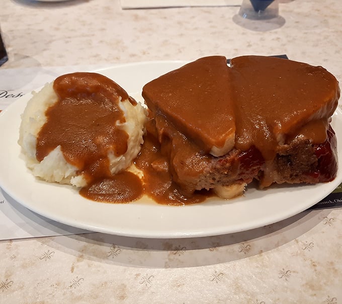 Meatloaf elevated to art form, crowned with caramel sauce that'll make you question everything you thought you knew.