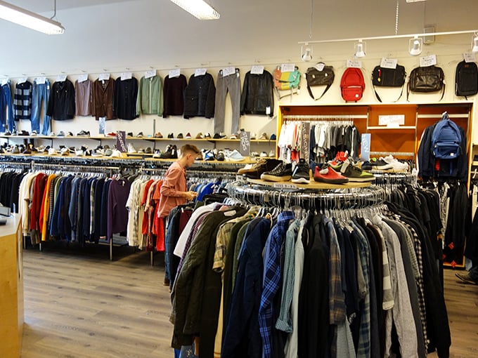 The men's department proves secondhand shopping isn't just for vintage-loving hipsters—quality basics and statement pieces peacefully coexist for every style personality.