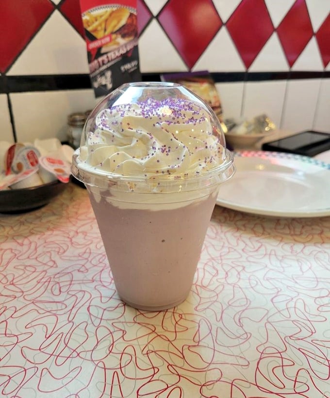 Milkshakes that require both a straw AND a spoon. The purple sprinkles aren't just decoration—they're a promise of childhood joy in adult form.