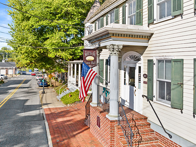 Milton's Town Hall stands proud with its classic columns and American flag—Norman Rockwell couldn't have painted it better himself.