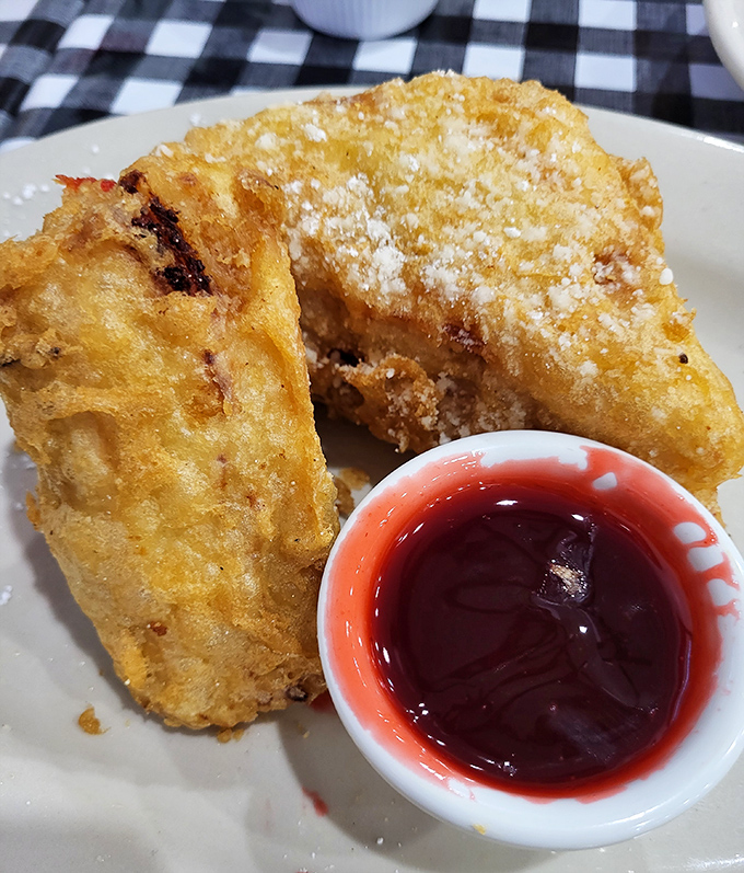 The Monte Cristo at Mel's is what happens when a sandwich goes to heaven—deep-fried perfection with that sweet raspberry sauce creating a flavor combination that's practically symphonic.