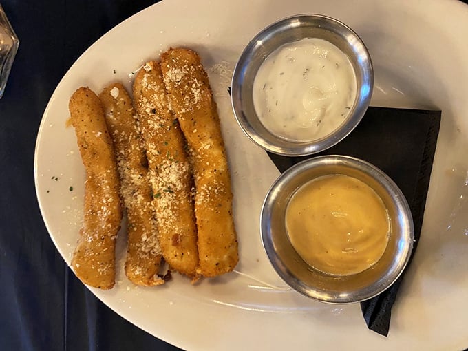 These aren't your average mozzarella sticks – they're golden-brown ambassadors of cheese, dusted with parmesan and served with dipping sauces that mean business.