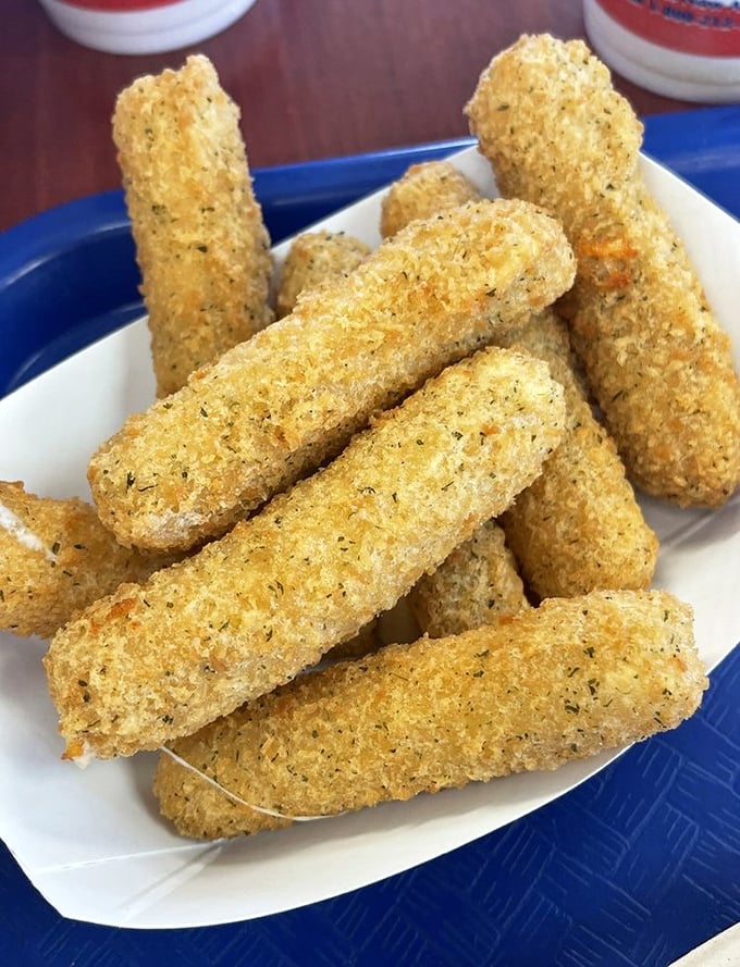 Not fish, but still fantastic—these golden mozzarella sticks stretch dramatically with each pull, like cheese performing its own Broadway show.