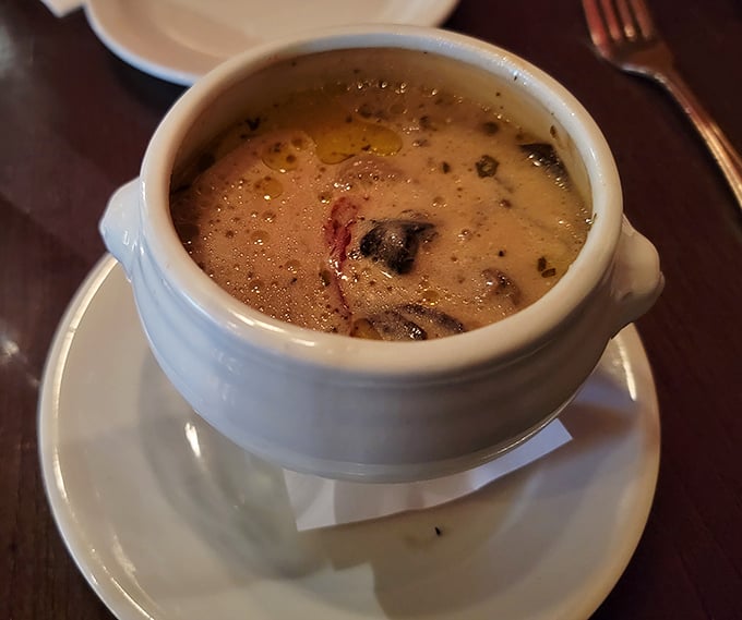 A bowl of mushroom soup that whispers, "Cancel your plans for the afternoon—you'll want to savor every spoonful of this earthy delight."