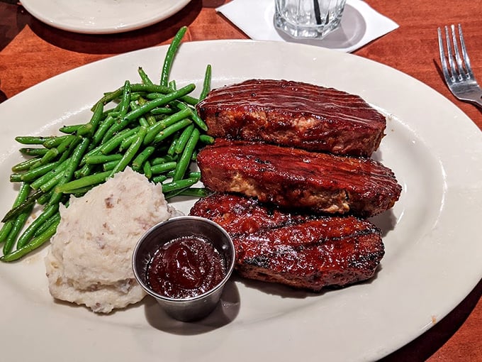 BBQ ribs that don't just fall off the bone—they practically leap onto your fork in a selfless act of delicious sacrifice.