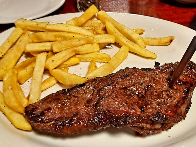 The NY Strip arrives with green beans that actually taste like vegetables should—a supporting actor that deserves its own award.