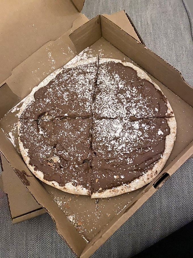 Nutella pizza: where dessert and dinner collide in a powdered-sugar dusted miracle that makes you question why we ever separated these meal categories.