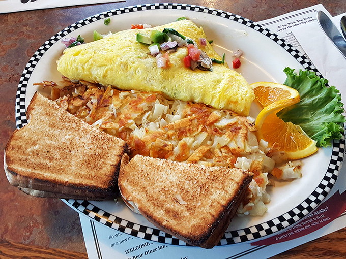 An omelet that's practically a work of art—fluffy, golden, and stuffed with fresh ingredients. The hash browns deserve their own fan club.