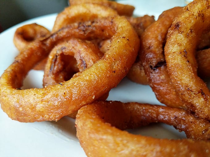 Onion rings with the perfect crunch-to-softness ratio—the kind that make you wonder why you ever waste calories on mediocre versions elsewhere.