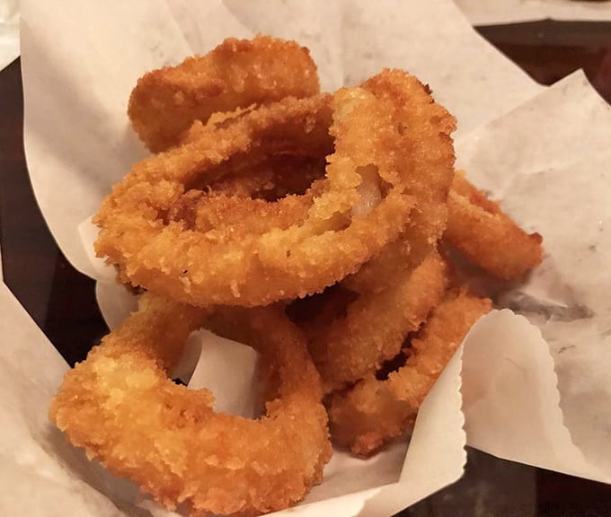 Golden-fried onion rings that shatter with each bite – the perfect supporting actor to the burger's leading role.