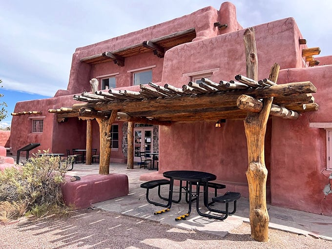 The Painted Desert Inn stands like a terra-cotta dream. This historic adobe structure offers shade, stories, and spectacular views that no hotel chain could match. 