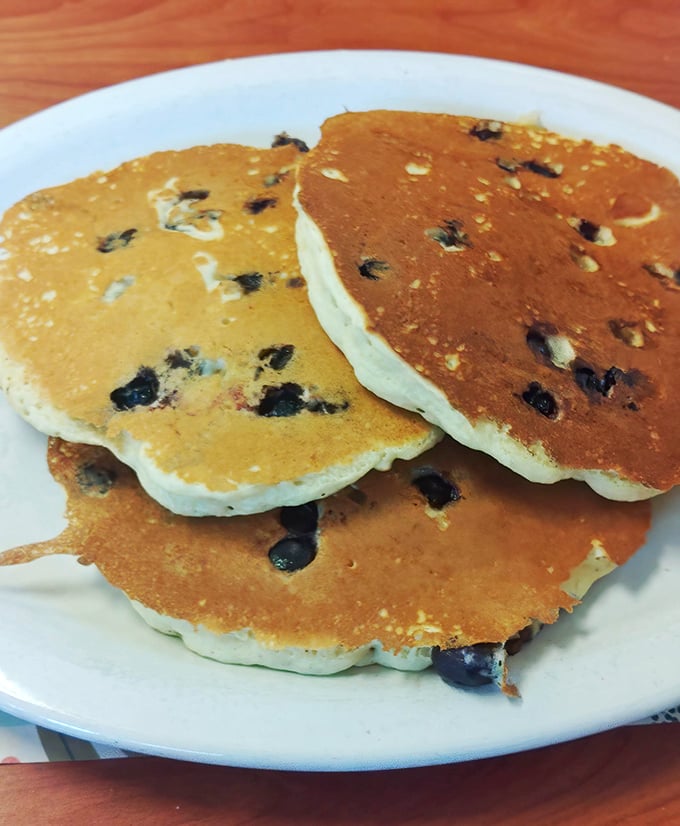 Blueberry pancakes that don't need Instagram filters – these fluffy discs of joy are the breakfast equivalent of winning the lottery.