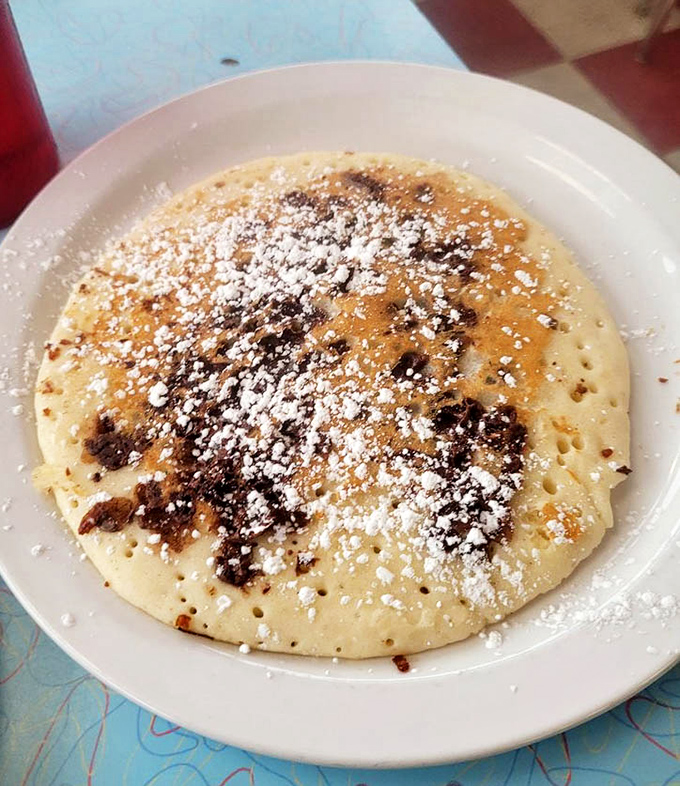 Pancake perfection with chocolate chips that haven't completely melted—creating those magical pockets of surprise sweetness in every bite.