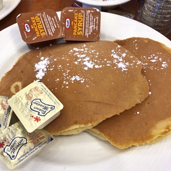 These pancakes aren't just breakfast, they're therapy—golden-brown canvases waiting for that perfect butter-to-syrup ratio that solves all of life's problems.