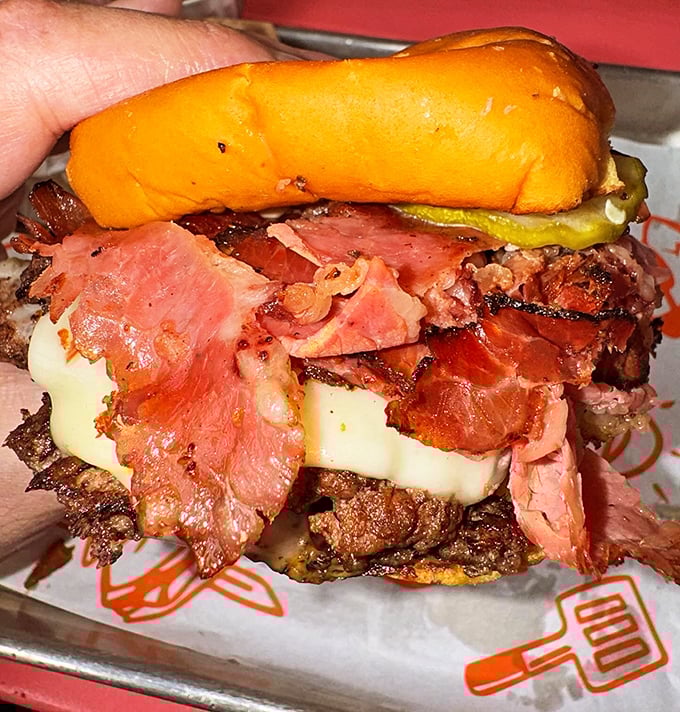 The Pastrami Burger doesn't just blur the line between sandwich categories—it obliterates it in the most delicious identity crisis ever.