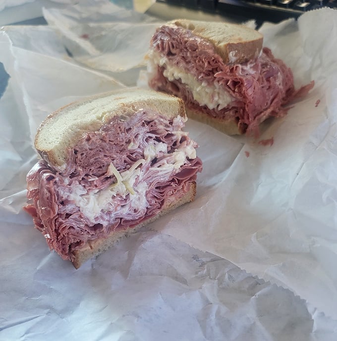This pastrami sandwich isn't messing around – pink, tender meat piled high with just enough bread to qualify as a delivery system.