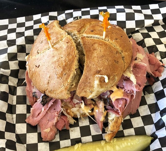 A pastrami sandwich so generous it requires structural engineering. The pickle on the side isn't garnish—it's necessary balance in a meat-centric universe.