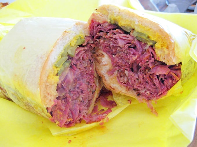 Not so much a sandwich as a meat monument—this pastrami masterpiece requires both hands, several napkins, and absolutely zero regrets.