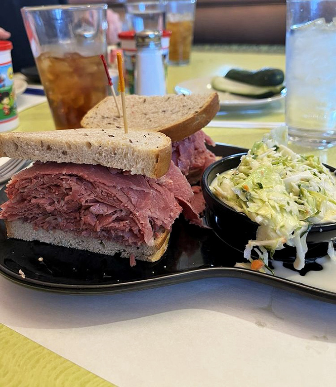 The star of the show: pastrami piled higher than Cleveland's hopes during playoff season. That coleslaw isn't a side—it's a necessary counterbalance.