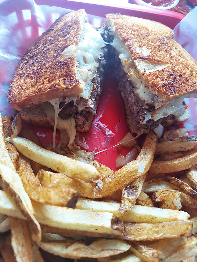 The patty melt—where burger meets grilled cheese in a beautiful union. Those crispy edges and melty interior are what sandwich dreams are made of.