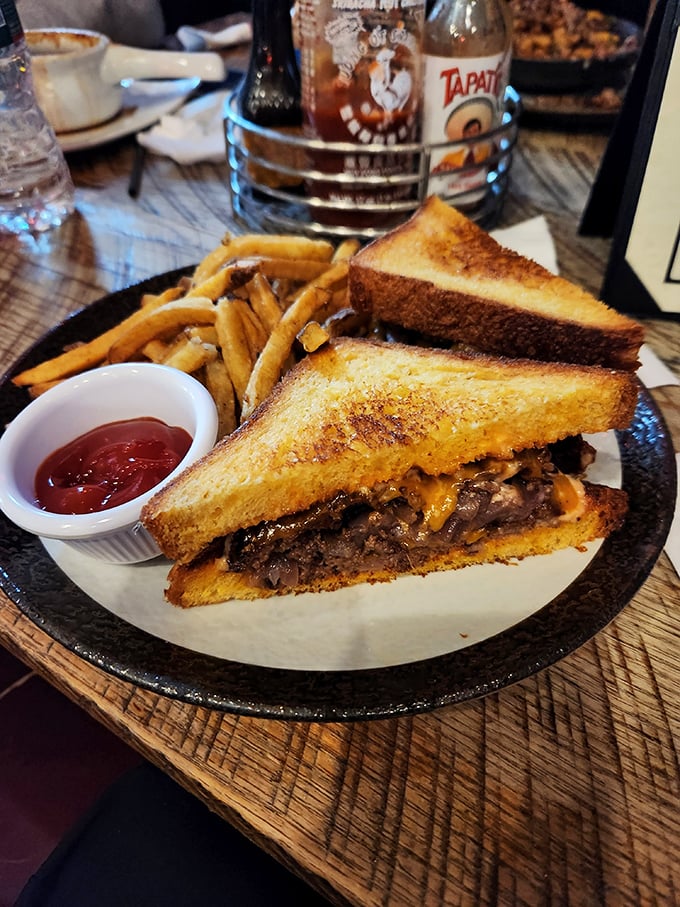 Comfort food elevated to an art form. This patty melt combines a perfectly seasoned burger with golden toast and melty cheese—the holy trinity of sandwich perfection.