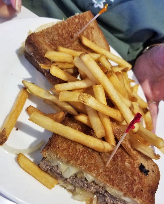 The patty melt—that perfect marriage of burger and grilled cheese. Those golden-brown edges are where dreams and extra napkins happen.