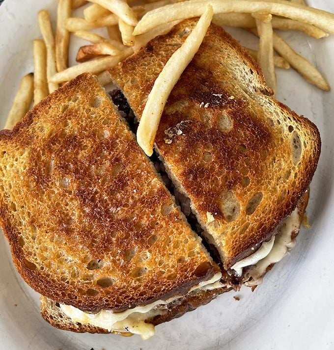 A proper diner patty melt should look exactly like this—golden bread, melty cheese, and a burger that knows its purpose in life is to make you happy.