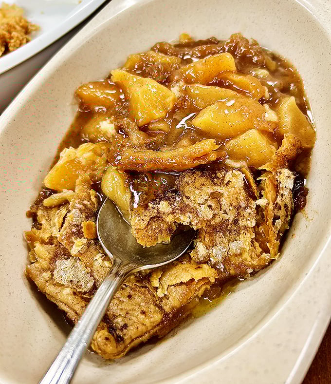 Peach cobbler that makes you understand why Georgia puts the fruit on its license plates. Not just dessert—it's a warm, gooey state treasure.