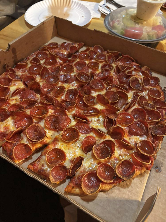 Pepperoni that curls into perfect little flavor cups, creating tiny pools of deliciousness. This isn't just pizza—it's edible art for the everyman.