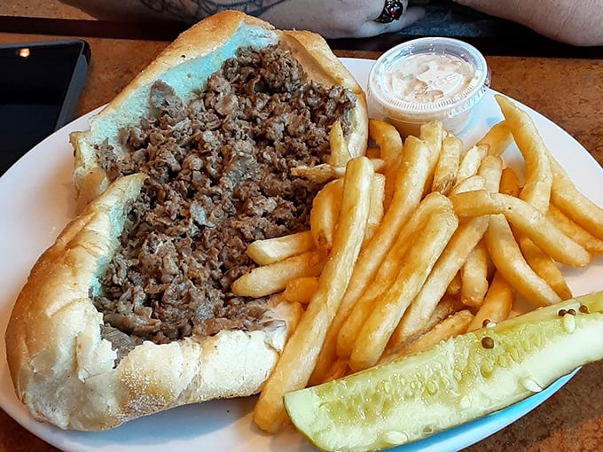 Not just a sandwich, but a Philadelphia institution—this cheesesteak overflows with thinly sliced beef, served with a pickle spear for good measure.