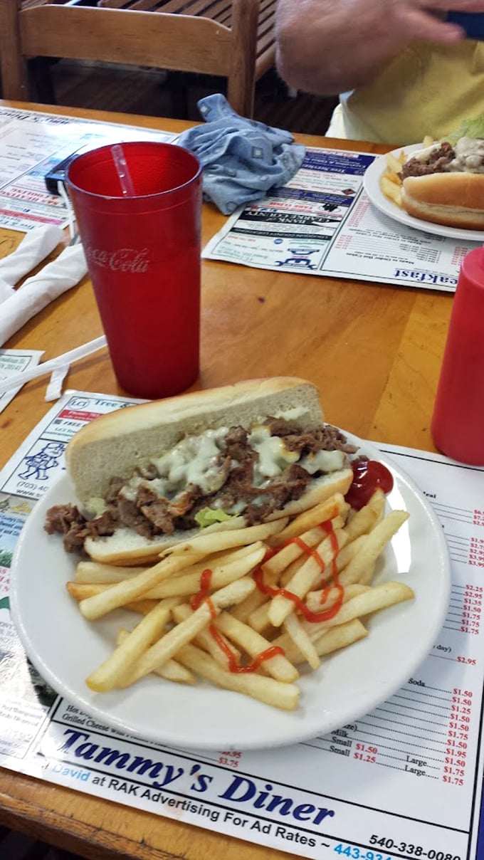 The humble cheesesteak with fries—proof that lunch at a breakfast joint can be just as satisfying as the morning offerings.
