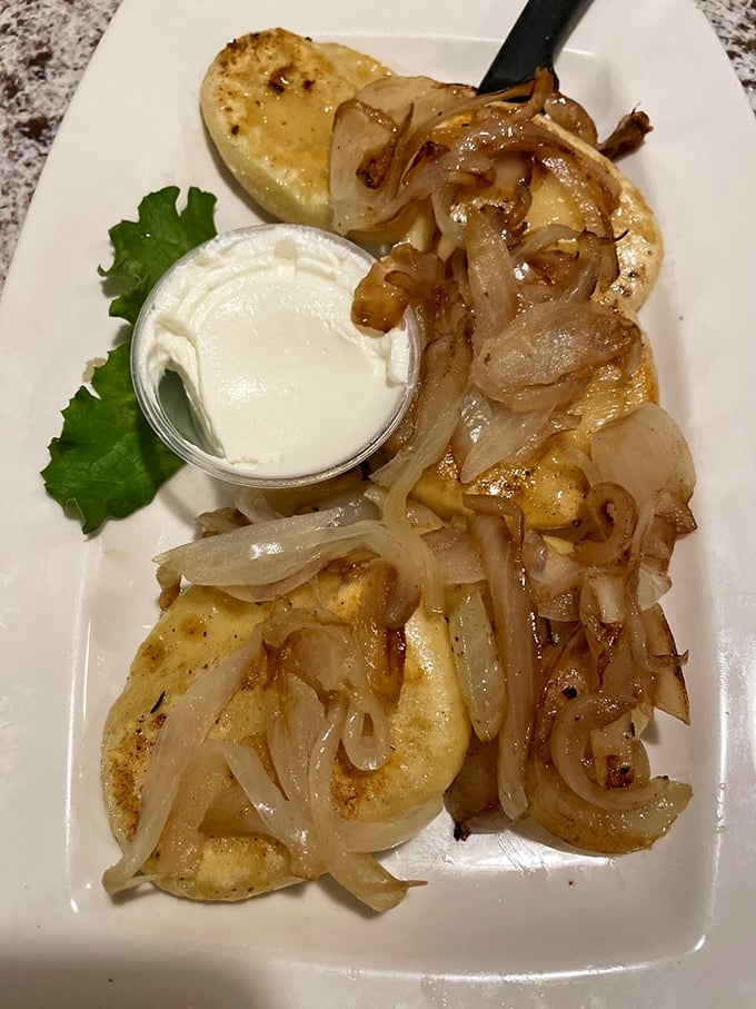 These pierogi, golden-brown and topped with caramelized onions, aren't just dumplings – they're edible time machines to your Eastern European grandmother's kitchen.