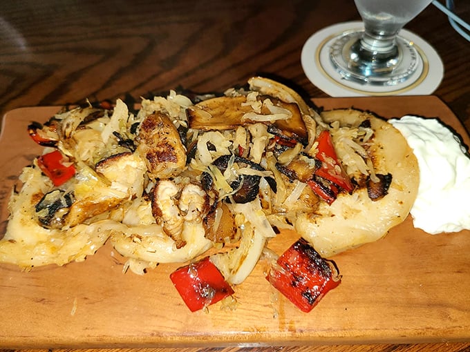 These aren't just pierogies – they're little pillows of happiness topped with caramelized onions and peppers that would make any Polish grandmother nod in approval.