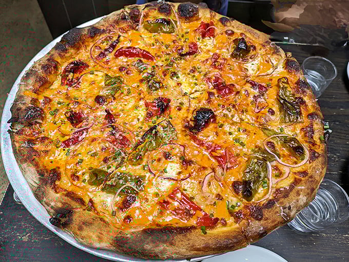 A symphony of colors and textures that delivers on its "angry" promise. This arrabiata pie doesn't just speak—it sings.