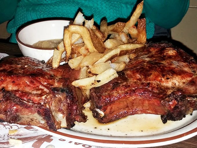 Ribs that look like they've been kissed by smoke and fire until they surrendered all their deliciousness. The fries aren't garnish—they're worthy sidekicks.