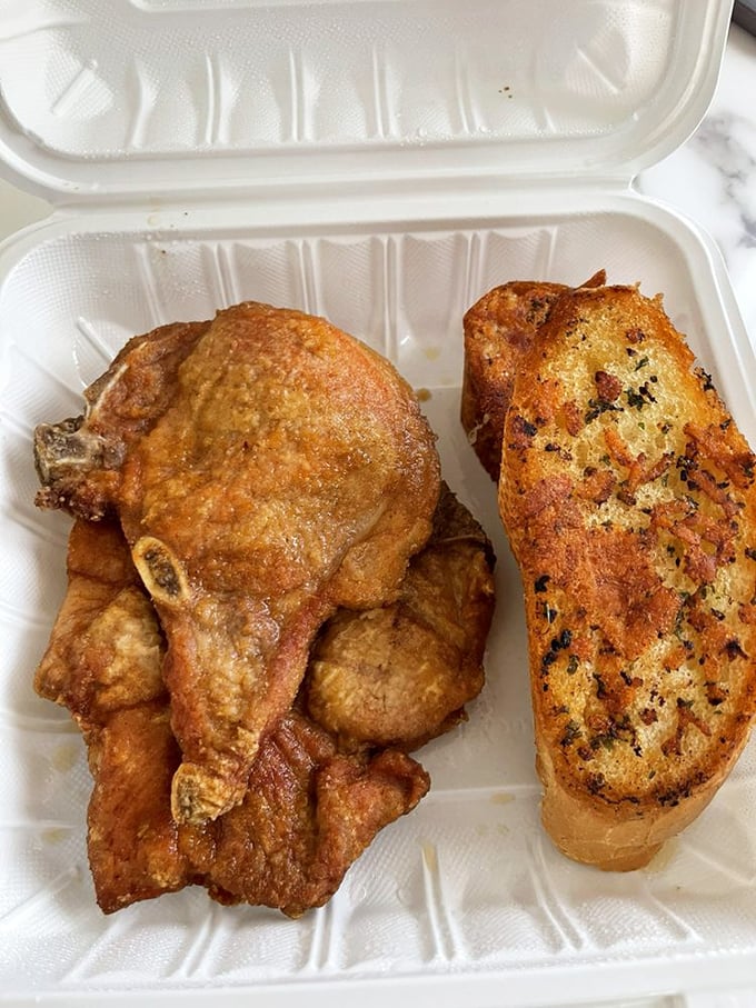 Golden-fried perfection meets homestyle cooking—this pork chop has clearly been introduced to the fryer by someone who knows what they're doing.