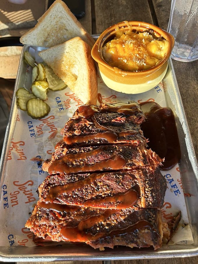 Pork ribs cascading like a meaty waterfall, each one lacquered with sauce that catches the light just right.
