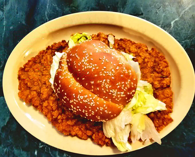 Breaded pork tenderloin so massive it's using the bun as a hat rather than a container. Midwestern engineering at its finest!