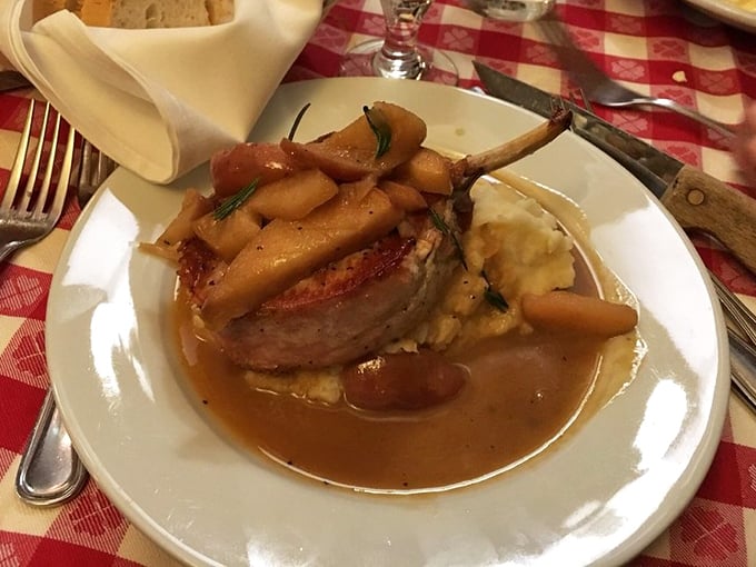 This isn't just any pork chop – it's a masterpiece with caramelized apples and a sauce so good you'll contemplate drinking it directly from the plate.