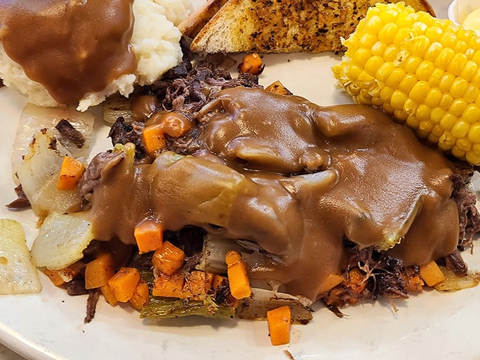 This pot roast doesn't just fall apart—it surrenders completely, surrounded by vegetables that have soaked up all those savory juices. Comfort food that hugs you from the inside.
