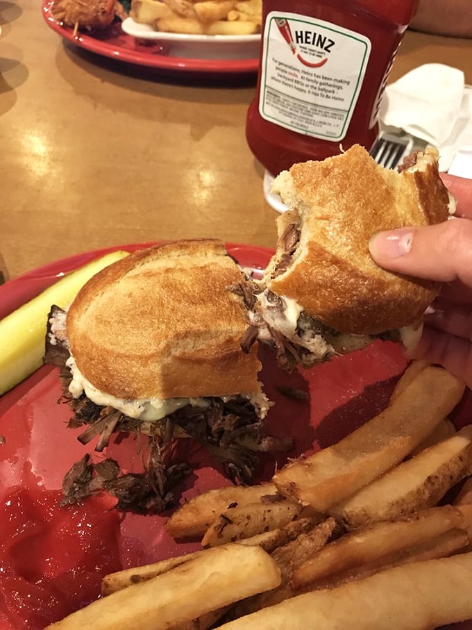 When pot roast meets sandwich perfection, magic happens – just look at that cheese stretching like edible gold between the halves.