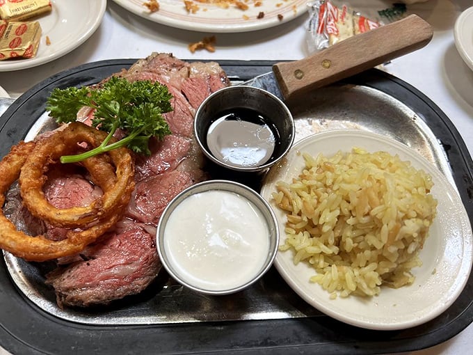 Prime rib so perfectly pink it could make a vegetarian question their life choices. The onion ring crown adds royal flair.