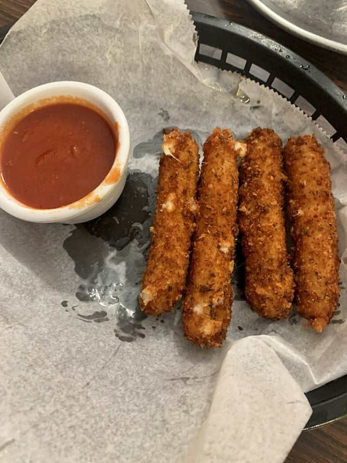Golden-brown provolone sticks that shatter with the first bite, revealing that magical cheese pull moment worth crossing state lines for.