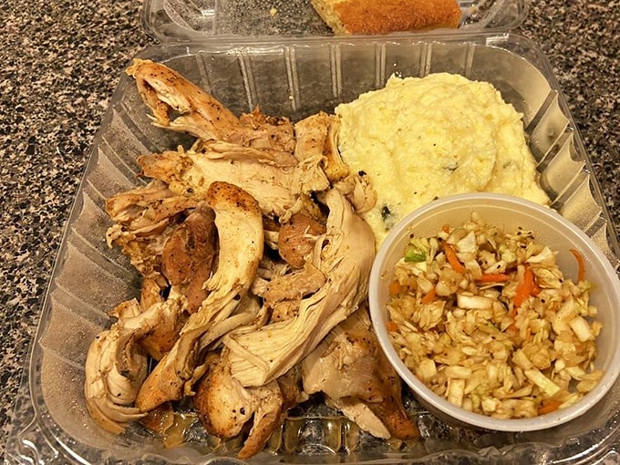 Pulled chicken that actually deserves your attention at a barbecue joint – tender, smoky, and ready to make you question your usual pork allegiance.