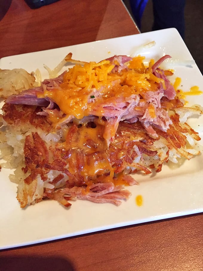Hash brown real estate topped with pulled pork and melted cheese. If this doesn't make you set your alarm for breakfast, check your pulse immediately.