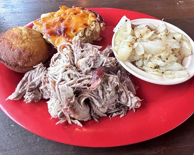 A pulled pork plate that showcases the art of patience—tender strands of smoke-kissed pork alongside mac and cheese that demands equal attention.