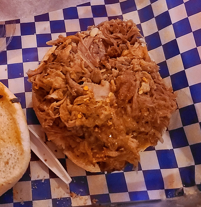 This isn't just pulled pork—it's meat that's had a spiritual awakening after hours in the smoker, ready to convert even the most devoted health nuts.