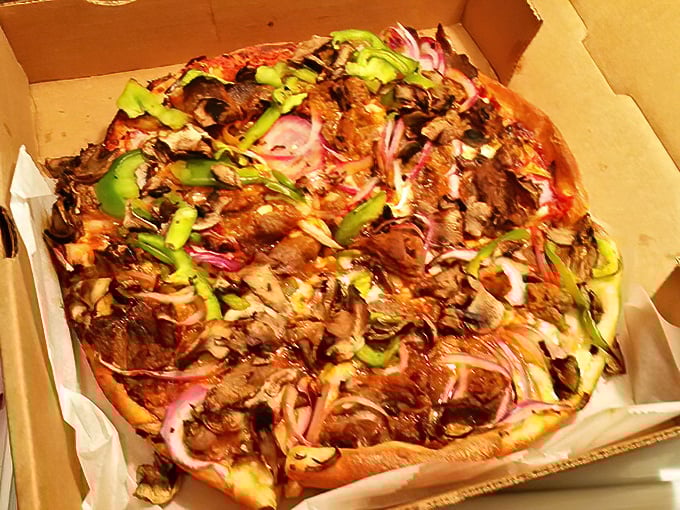 A meat lover's dream realized—this pulled pork pizza doesn't just have toppings, it has an entire barbecue party happening on dough.